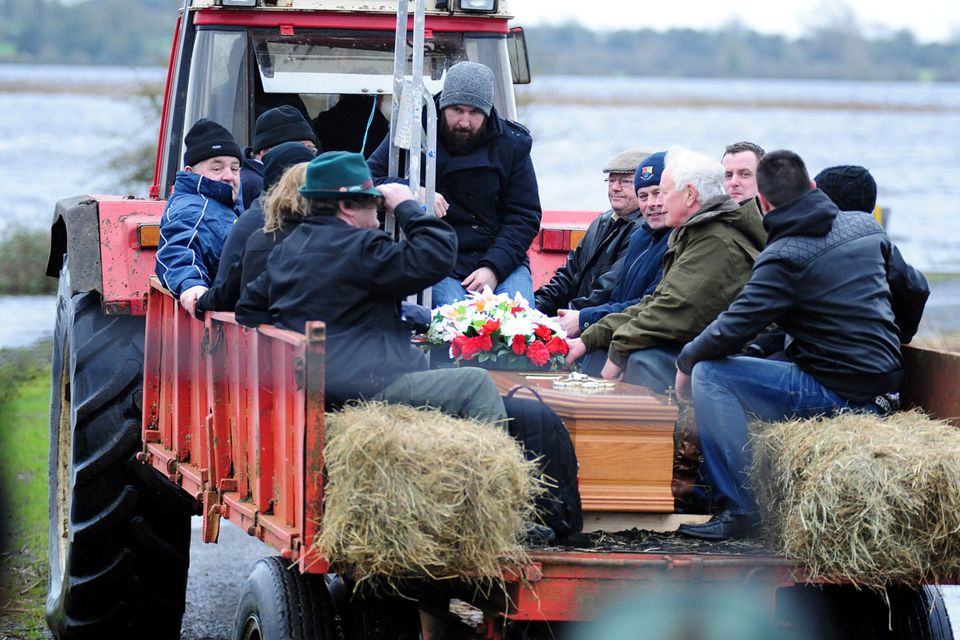 Coffin carried to funeral by tractor due to bad conditions | Irish ...