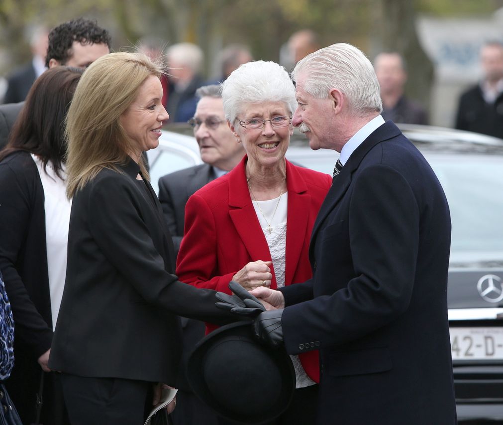Mourners say fond farewell at the funeral of football star Ray Treacy ...
