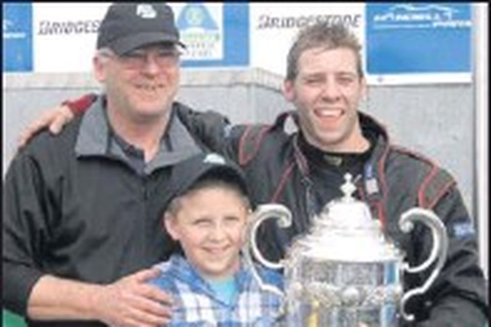 Wicklow's Kevin Sheane lifts the Leinster Trophy to add his name to a ...