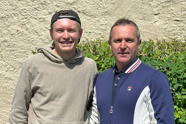 Wexford’s Kevin Cogley helping American sprinter Coby Hilton get on the ...