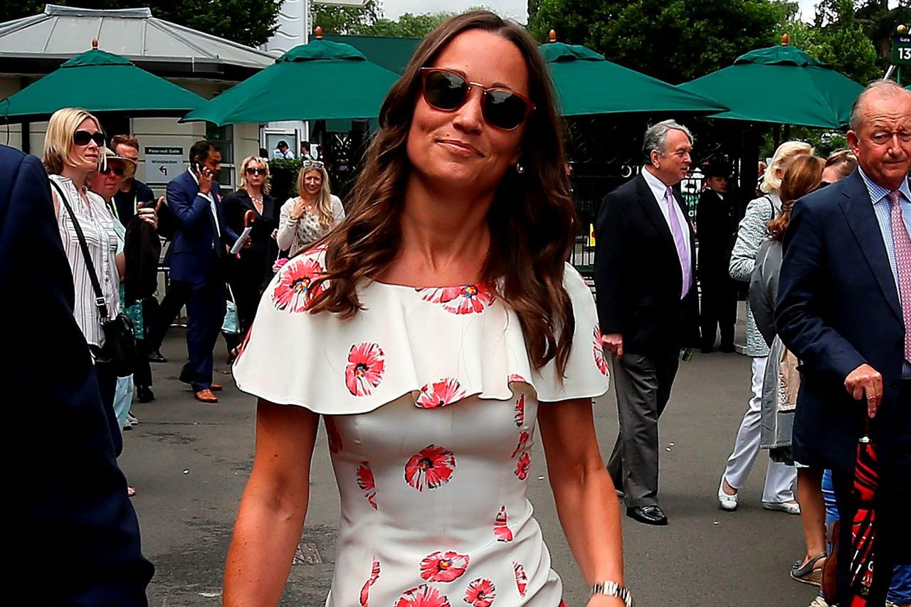 Pippa Middleton cuts a stylish figure in patterned pink as she leads ...