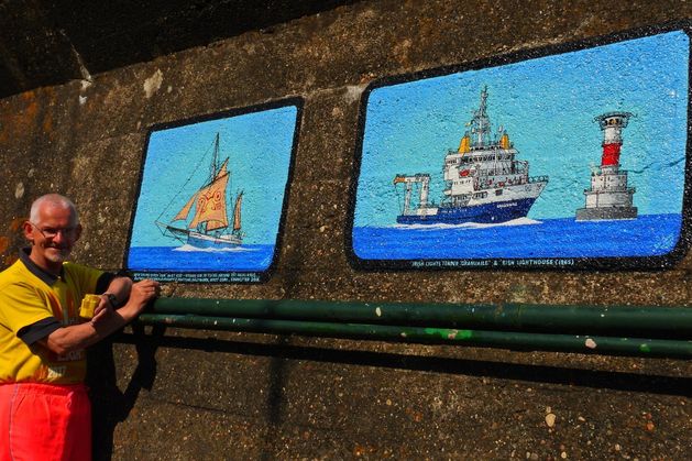 Pat Davis paints 68th mural on pier wall at Wicklow Harbour | Irish ...