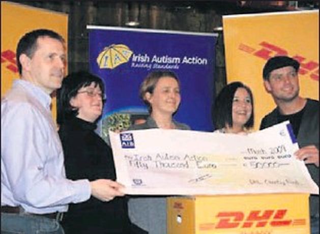 DHL staff deliver cheque for autism association | Irish Independent