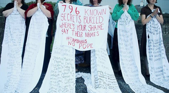 Names of 796 babies written on white sheets and sewn to fence at Tuam ...