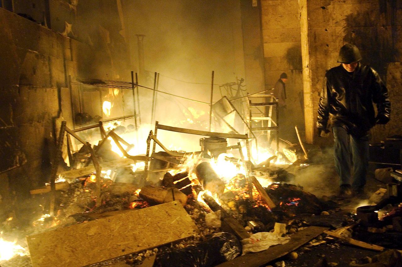 In Pictures: Dramatic scenes as riot police attack protest camp in Kiev ...
