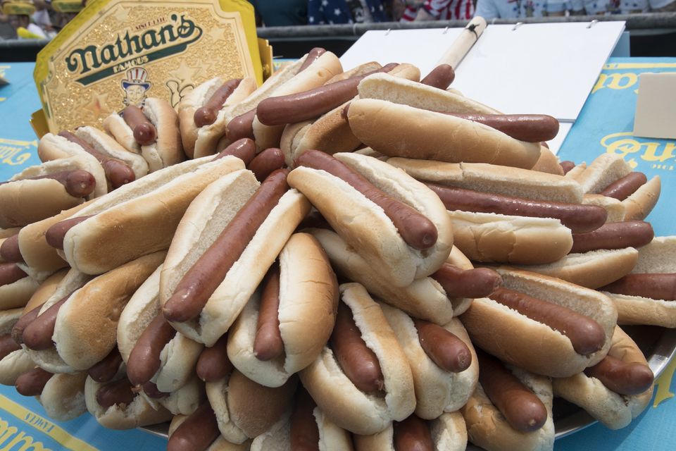 Woman eats 37 hot dogs to win July 4 eating contest | Irish Independent