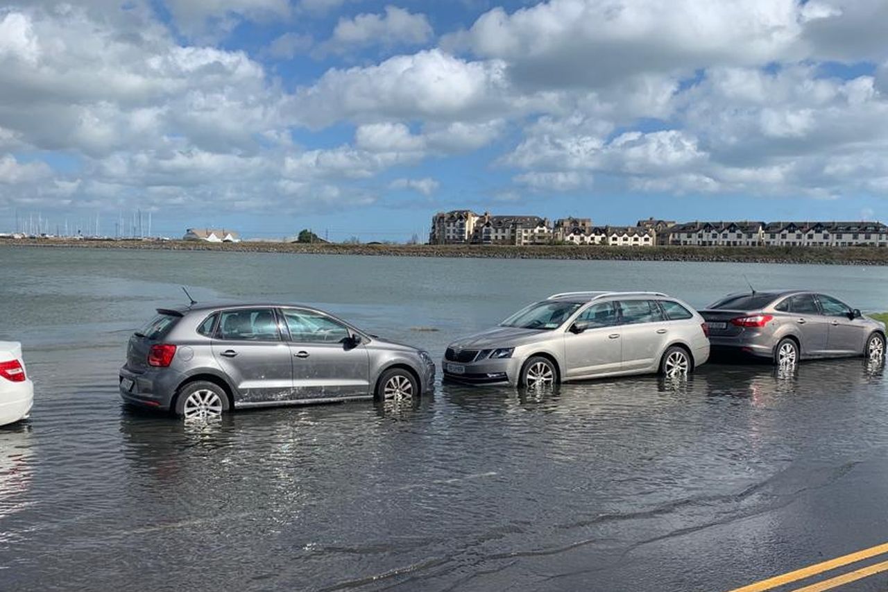 Cars submerged as extremely high tide causes severe flooding in ...